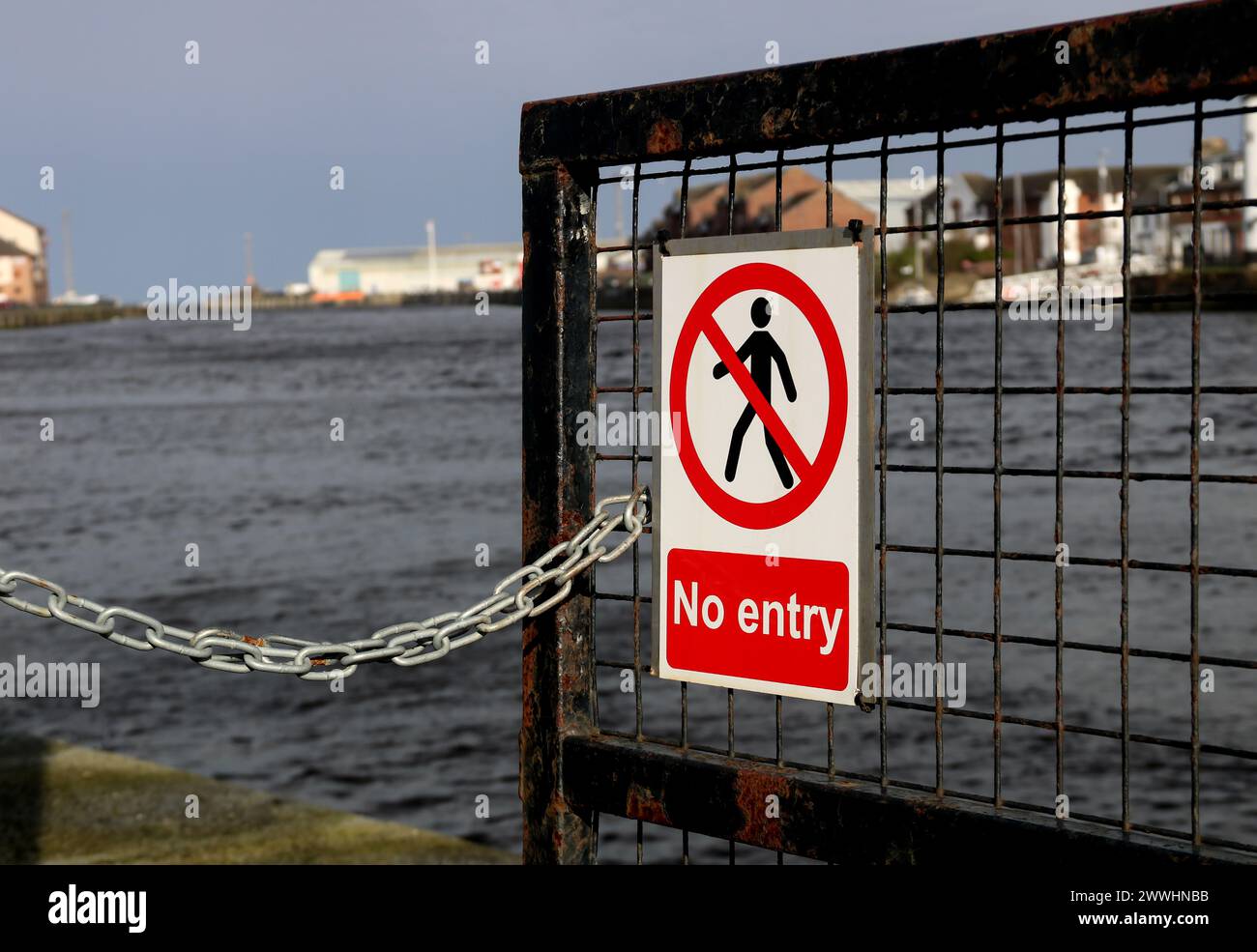 Pedestrian no entry warning sign at an urban river estuary location ...