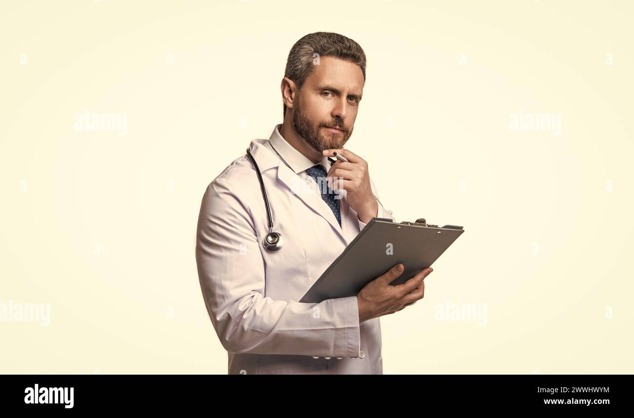 pondering internist with anamnesis on background. photo of internist ...