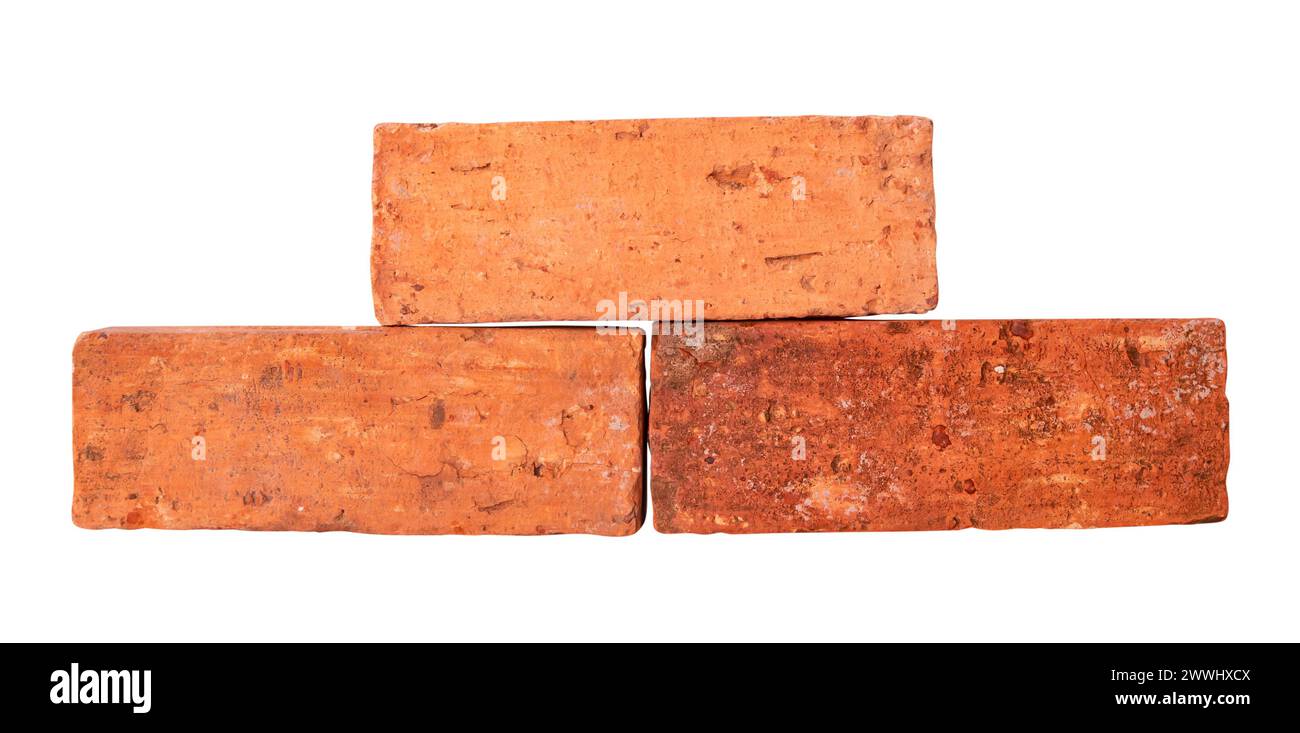 Front view of old cracked red or orange bricks in stack is isolated on ...
