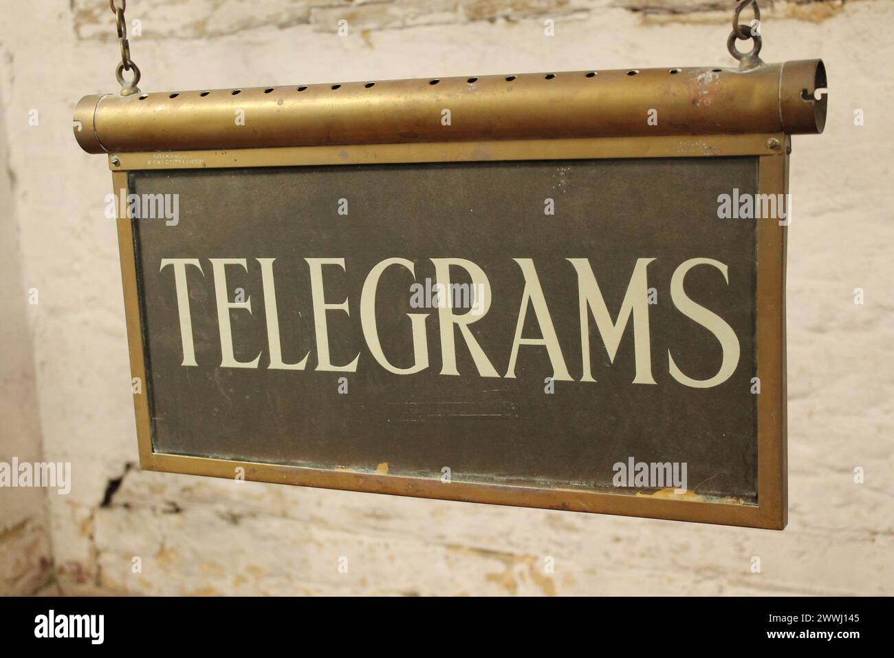 An antique 1920s brass and glass English Telegrams sign Stock Photo - Alamy