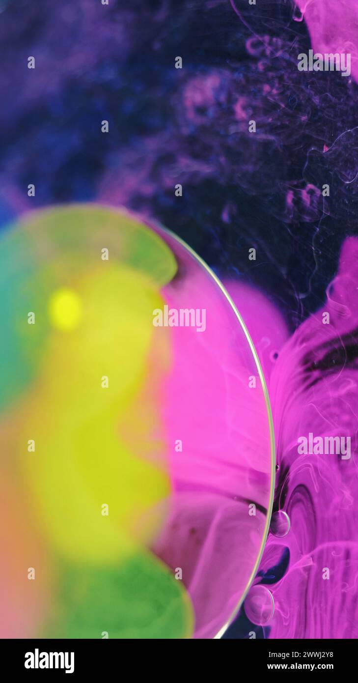 Paint water drop dye splash yellow pink oil bubble Stock Photo - Alamy