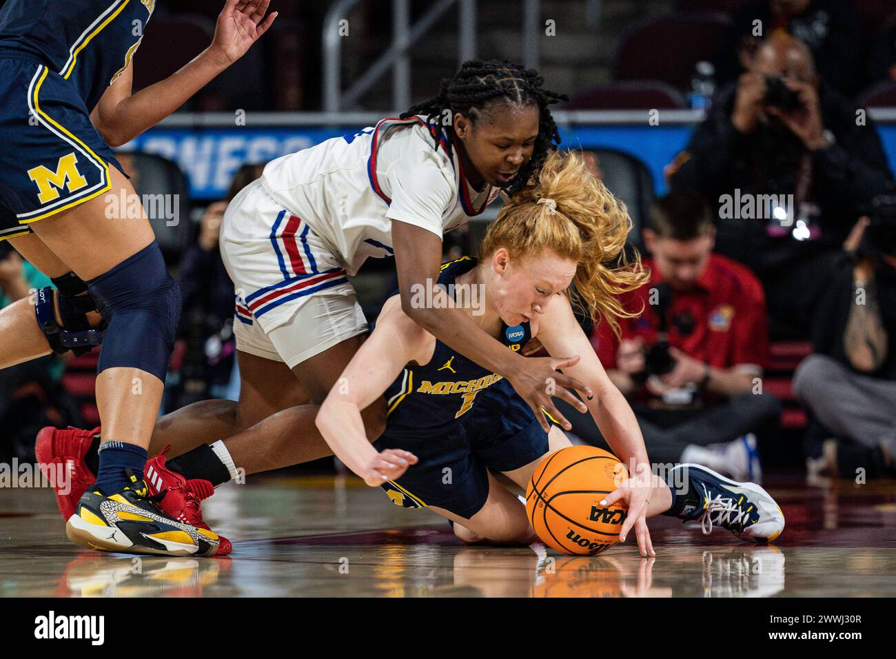 Michigan Wolverines guard Lauren Hansen (1) is fouled by Kansas ...