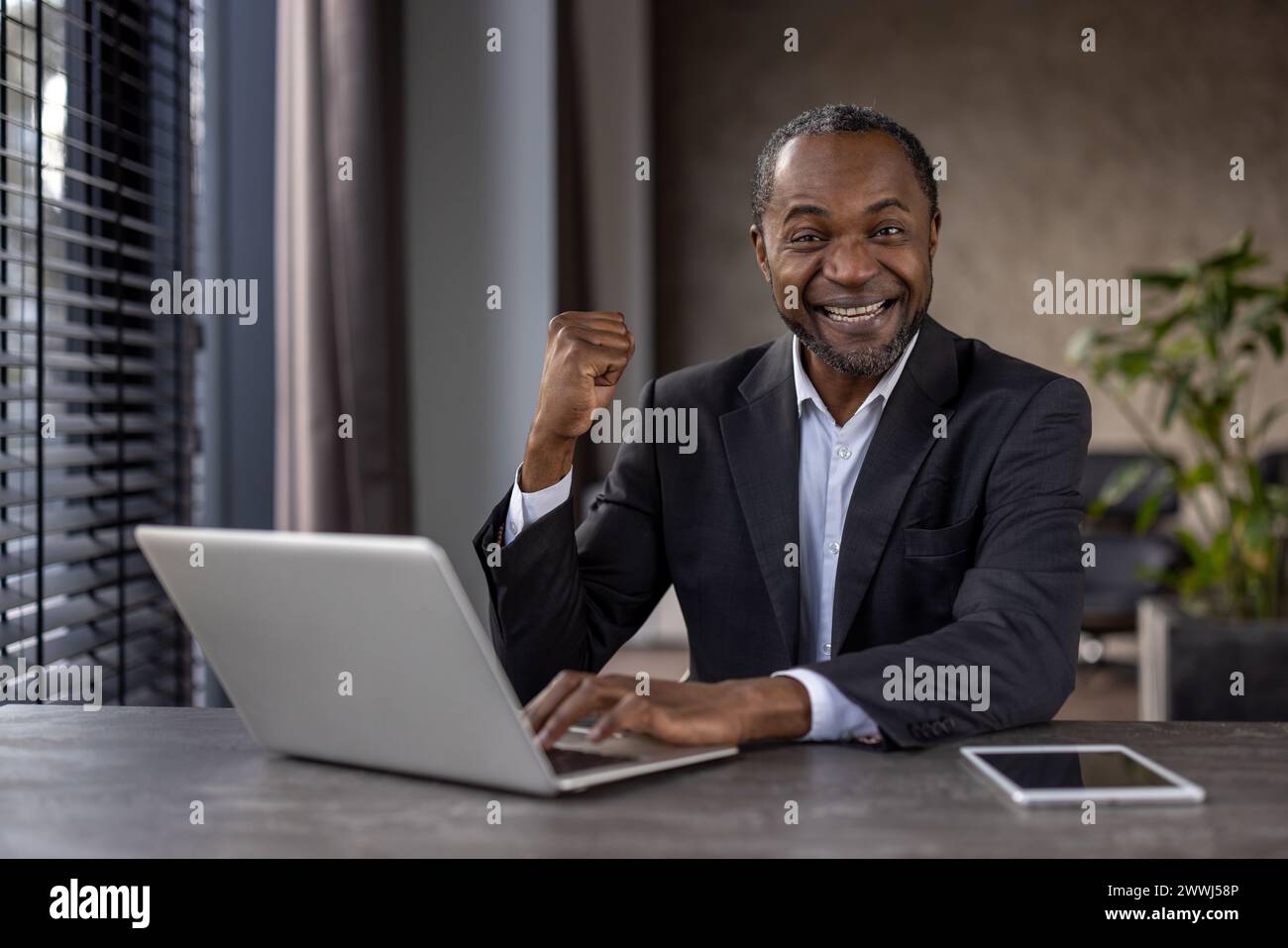 Portrait of mature experienced man businessman winner, senior african ...