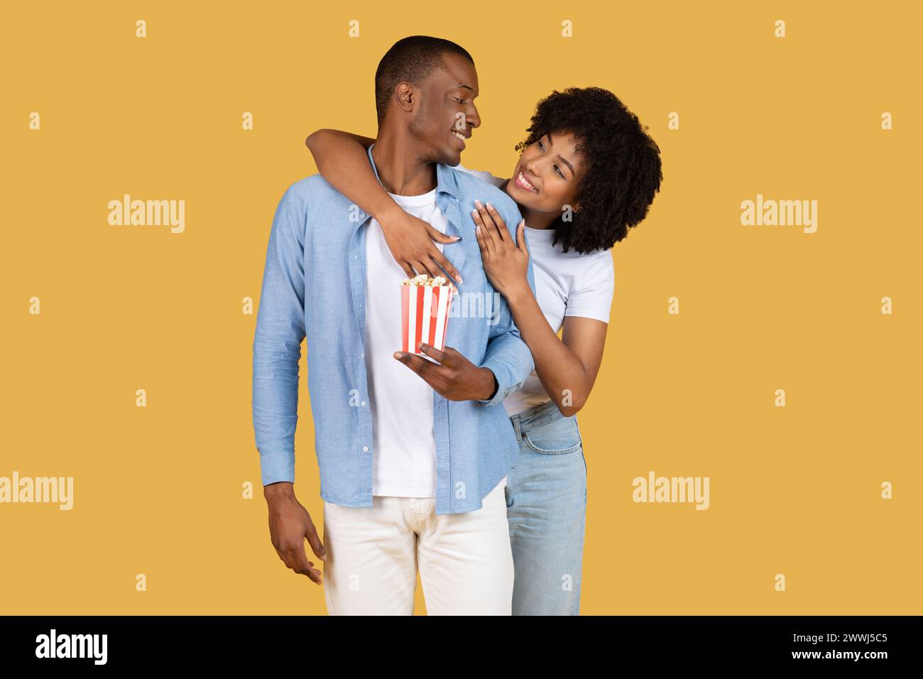 Affectionate and joyful couple sharing a moment of laughter and ...