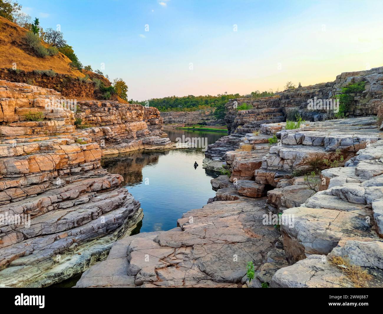 A beautiful lake surrounded by rocky mountain at Chidiya Bhadak, Indore ...