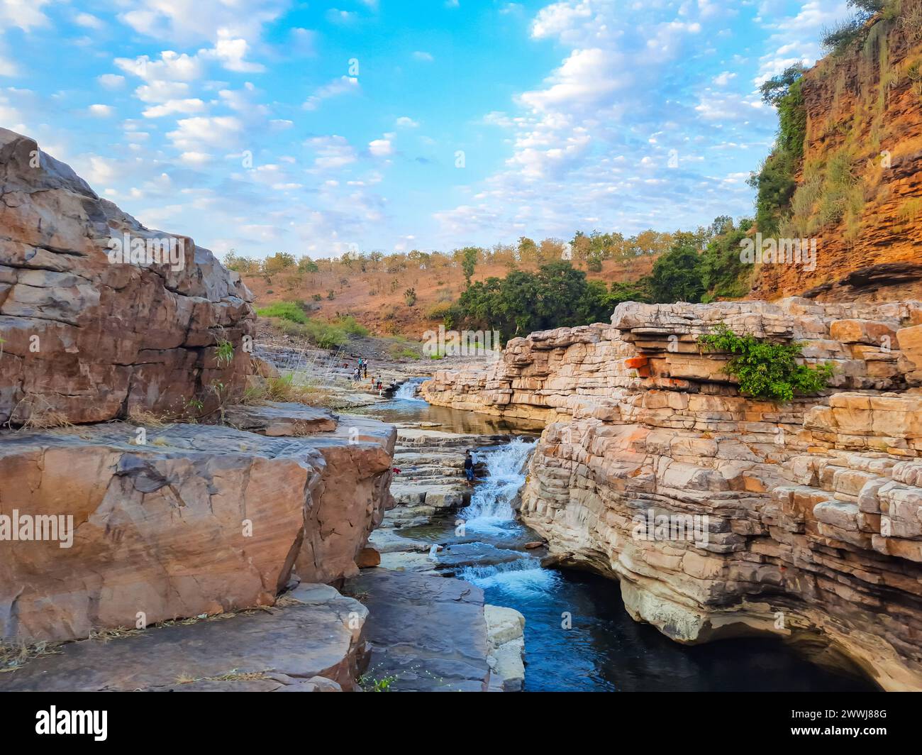 A beautiful waterfall surrounded by rocky mountain at Chidiya Bhadak ...