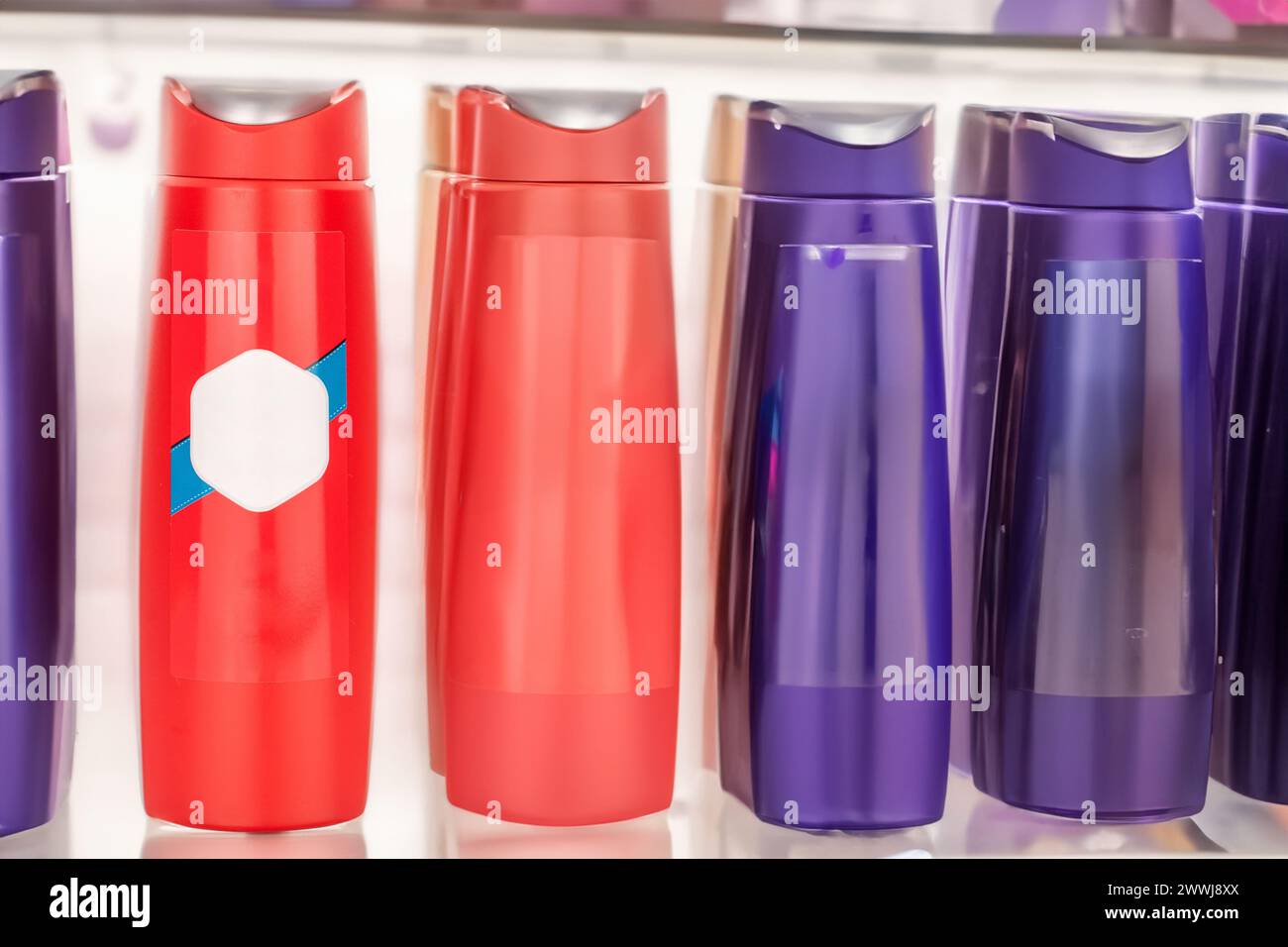 Several containers of shampoo on shelves, macro Stock Photo - Alamy