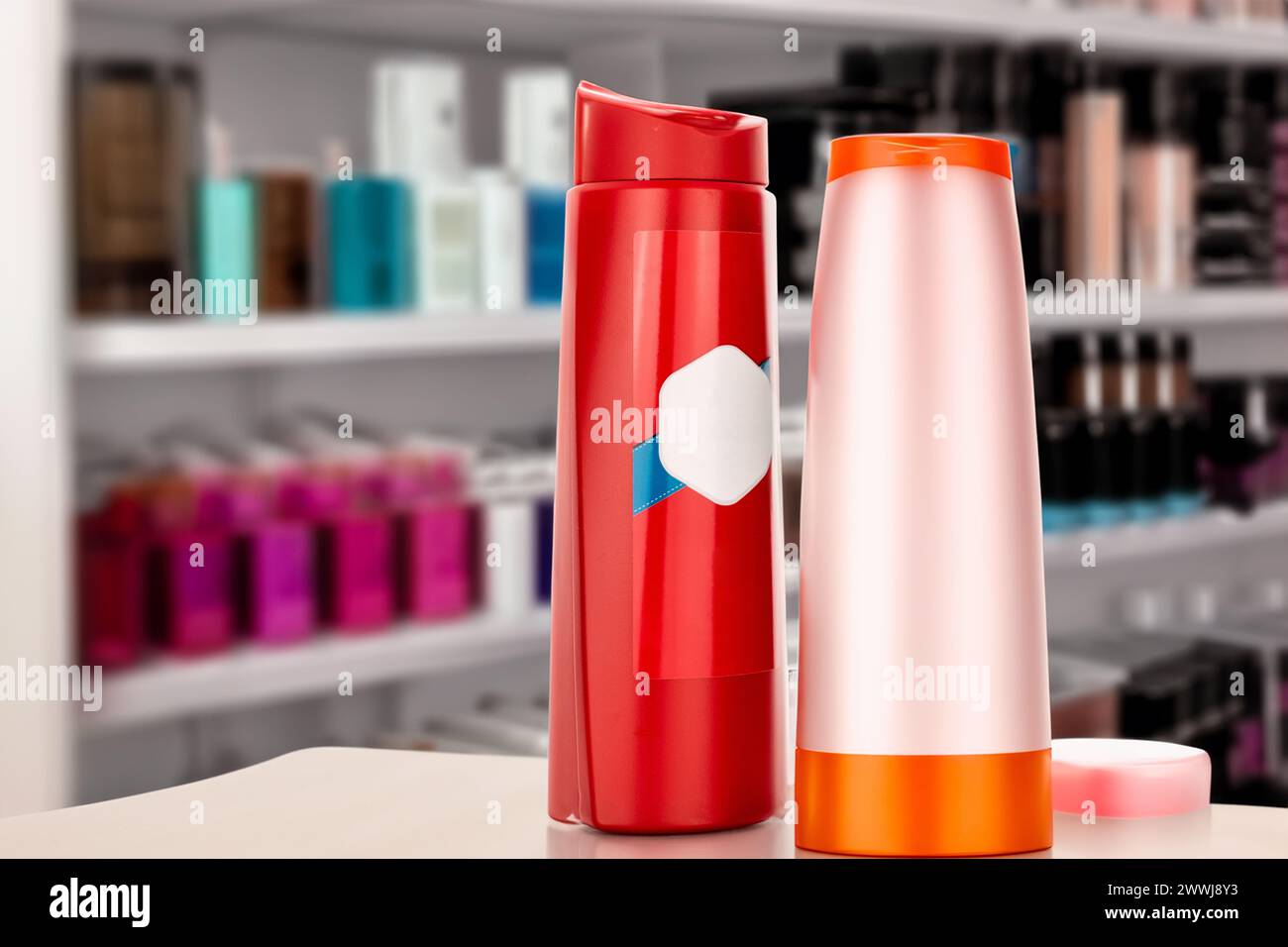 Two containers of shampoo on the background of shelves with cosmetics ...