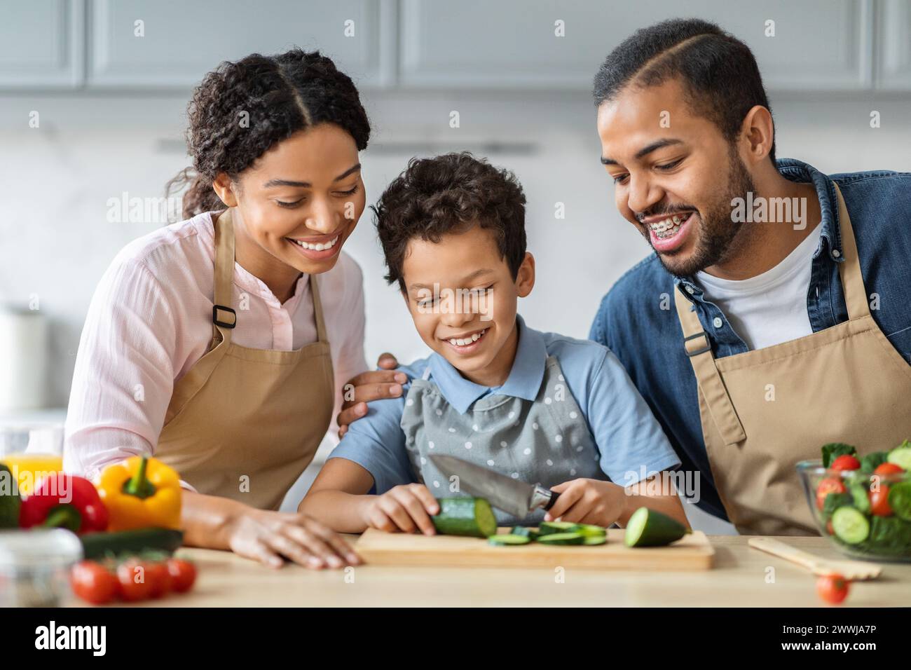 Mother son kitchen cooker hi-res stock photography and images - Alamy