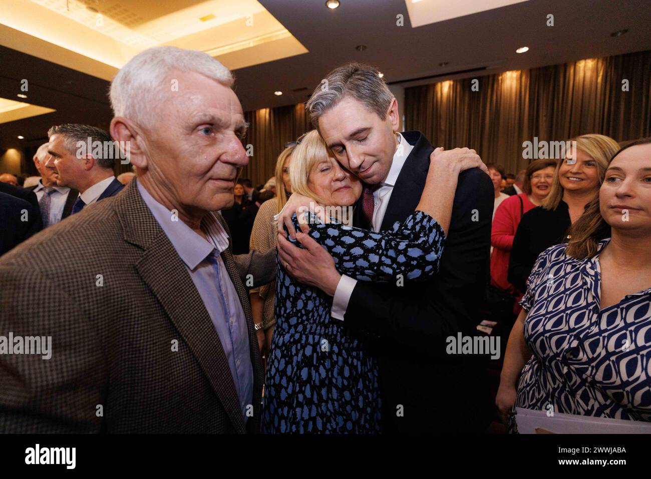 Simon Harris is hugged after being confirmed as the new leader of Fine ...