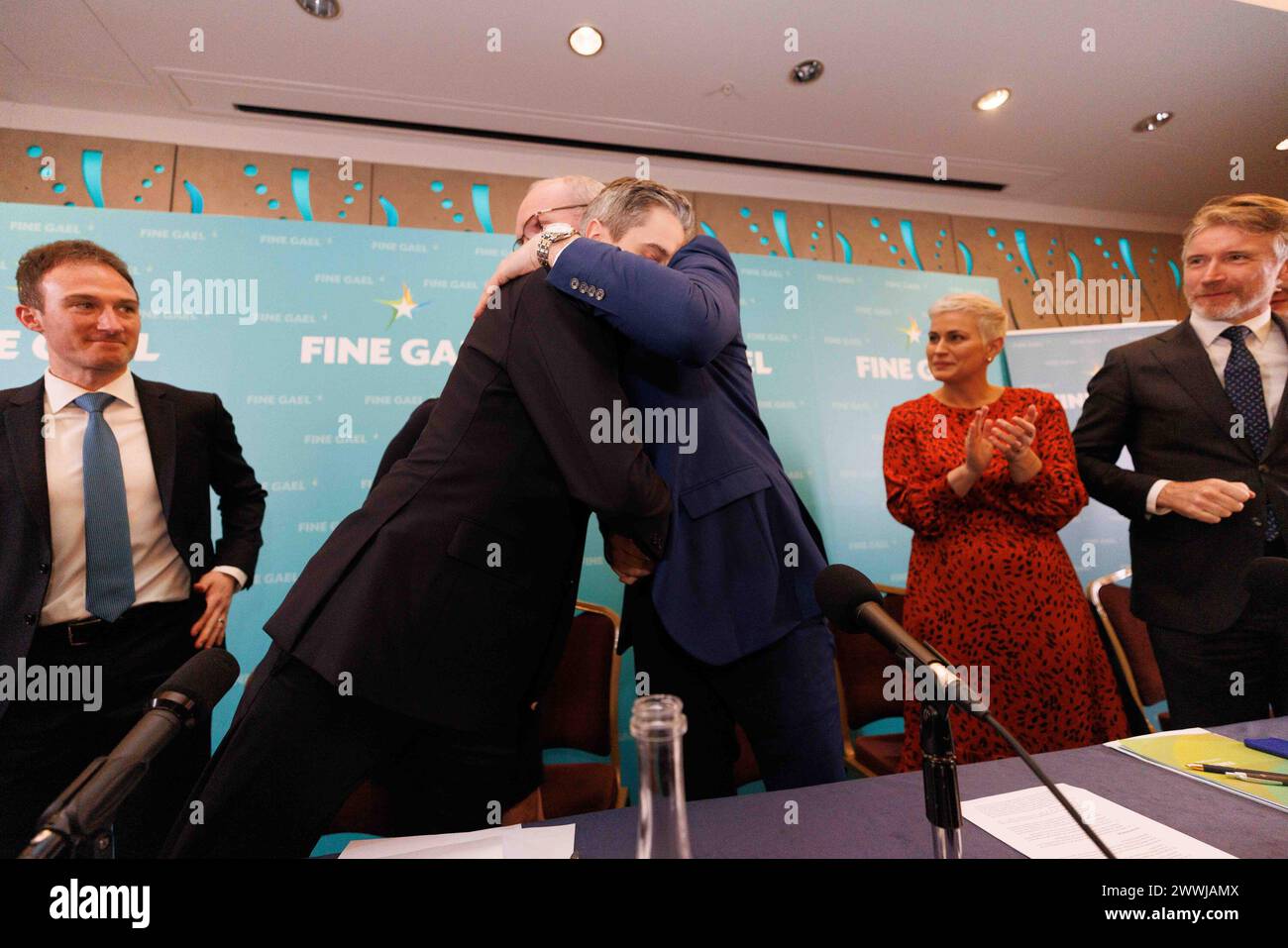 Simon Harris (left) is hugged by Fine Gael deputy leader Simon Coveney ...