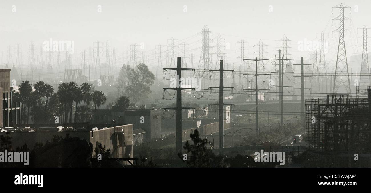 Gloomy cityscape of smoggy Los Angeles suburb covered in power poles ...
