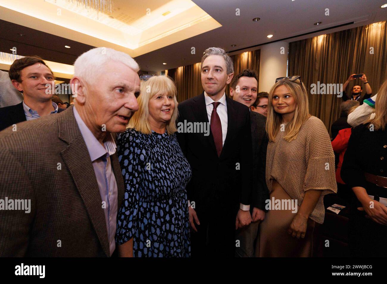 Simon Harris with his parents Mary and Bart, and other family members ...