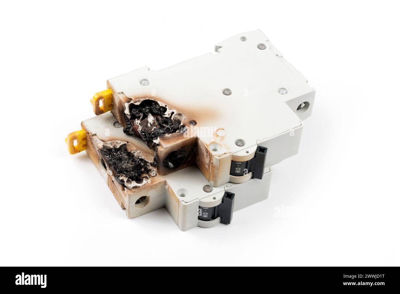 Pair of electric automatic circuit breaker burnt out on white ...