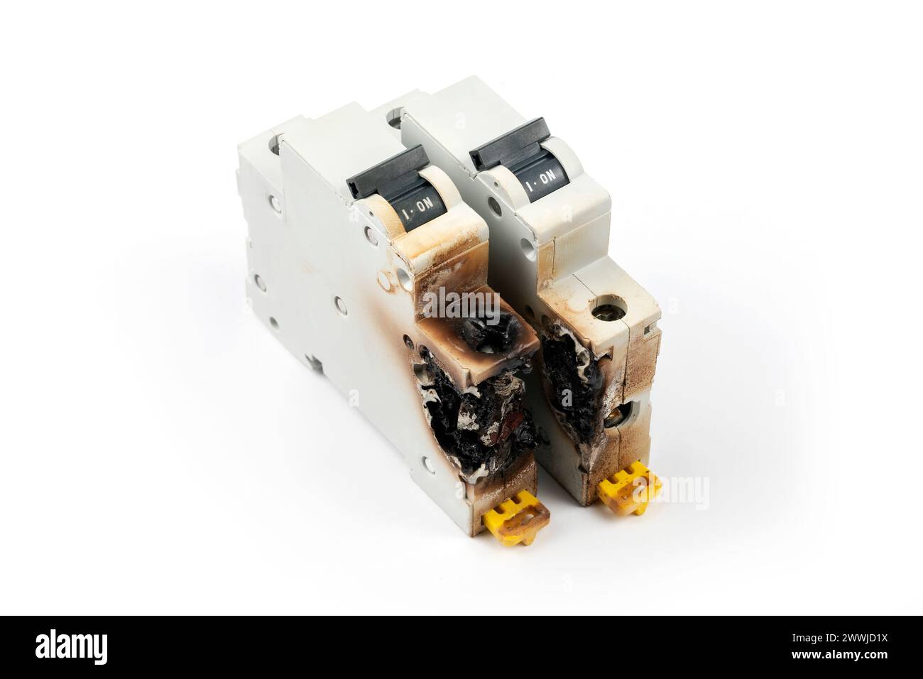 Pair of electric automatic circuit breaker burnt out on white ...