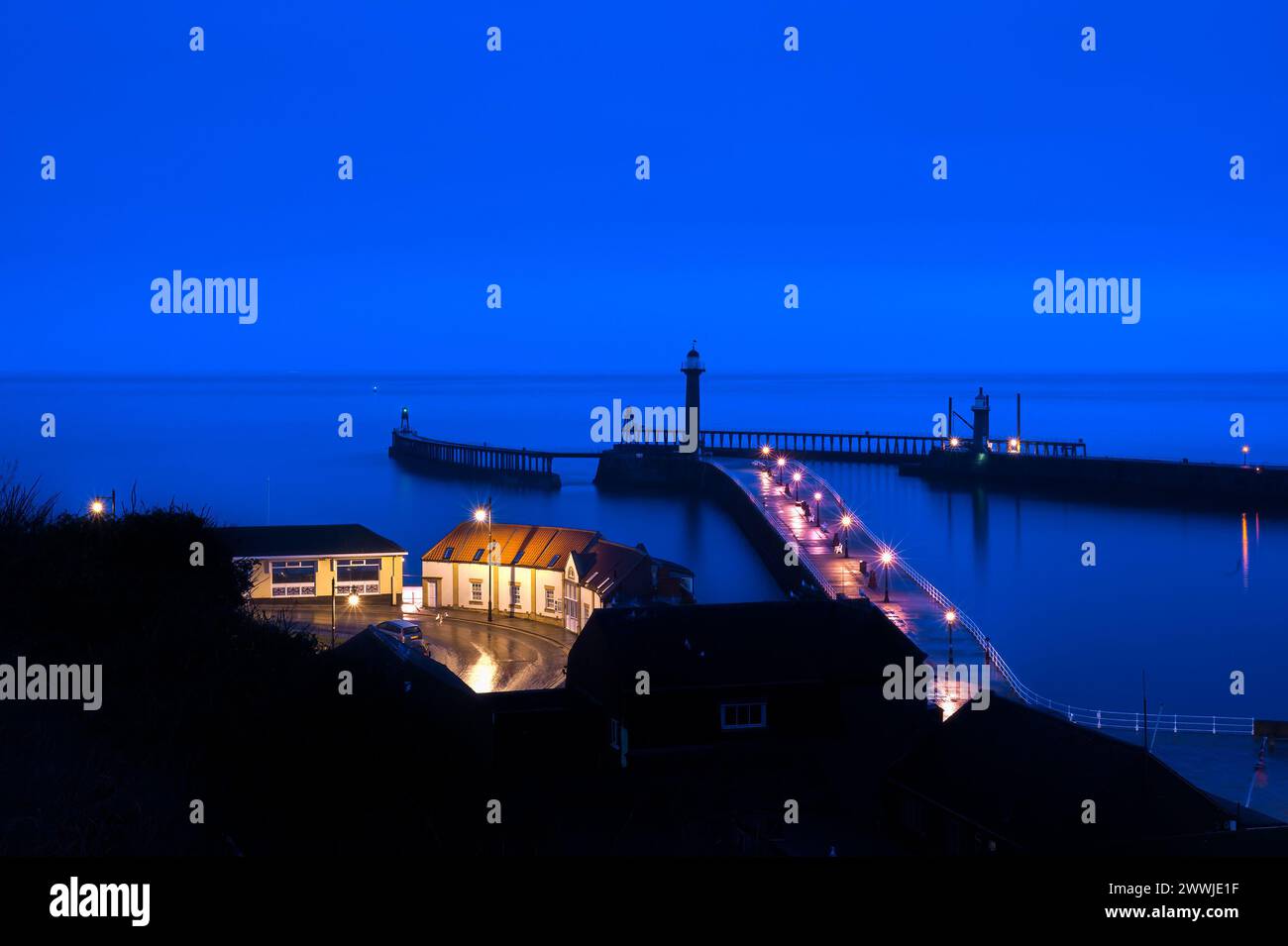 WHITBY, NORTH YORKSHIRE, UK - MARCH 20, 2010: Whitby Harbour and piers ...