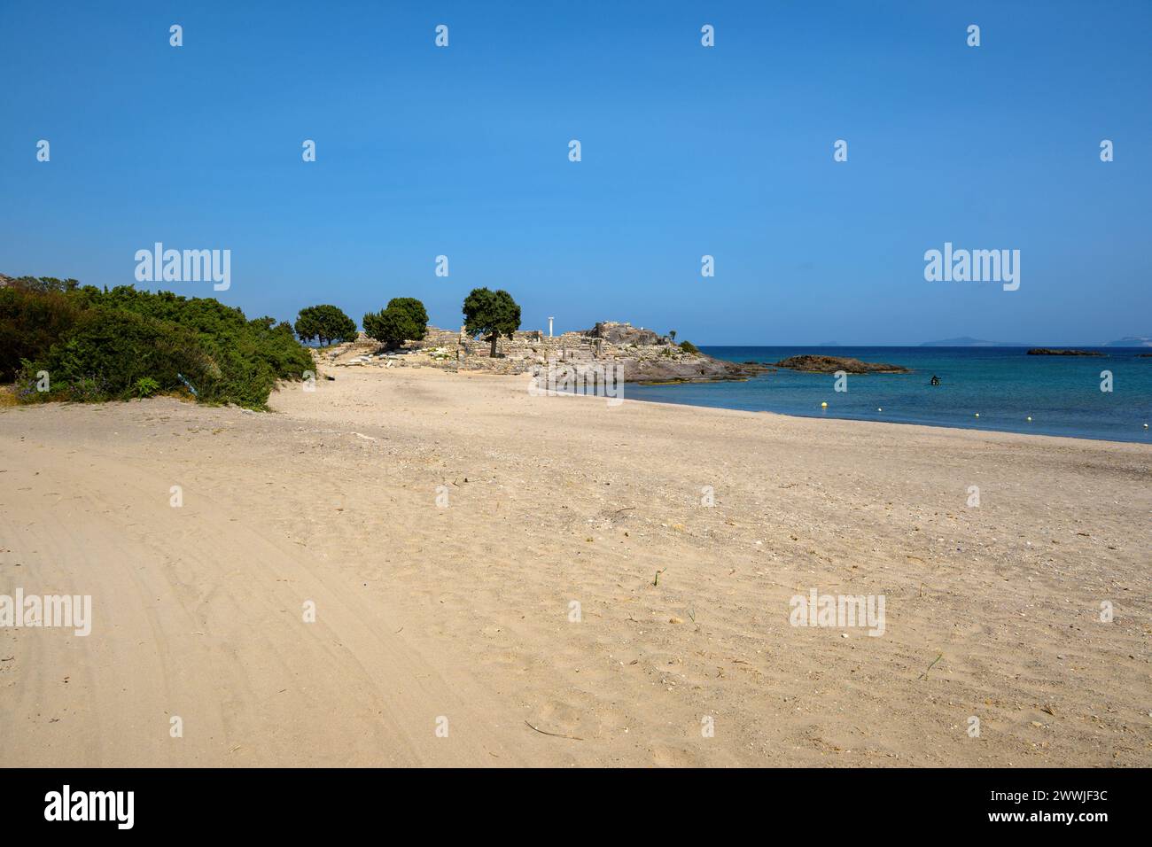 Agios Stefanos beach, a long beach of sand and fine pebbles on the ...