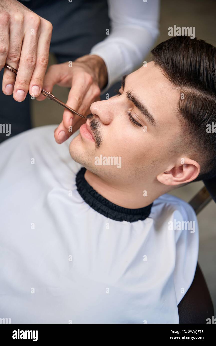 Client visiting barber shop for styling his mustache Stock Photo - Alamy