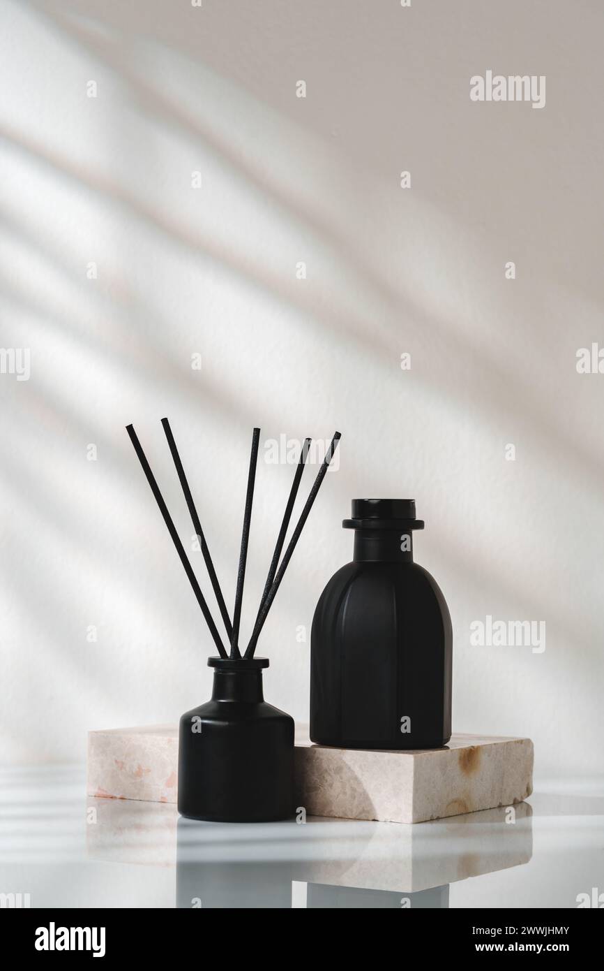 Elegant Aroma Diffuser With Black Reeds on a Marble Stand in Soft ...