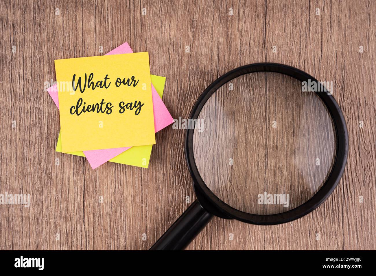 What our clients say word on sticky note and magnifying glass Stock ...