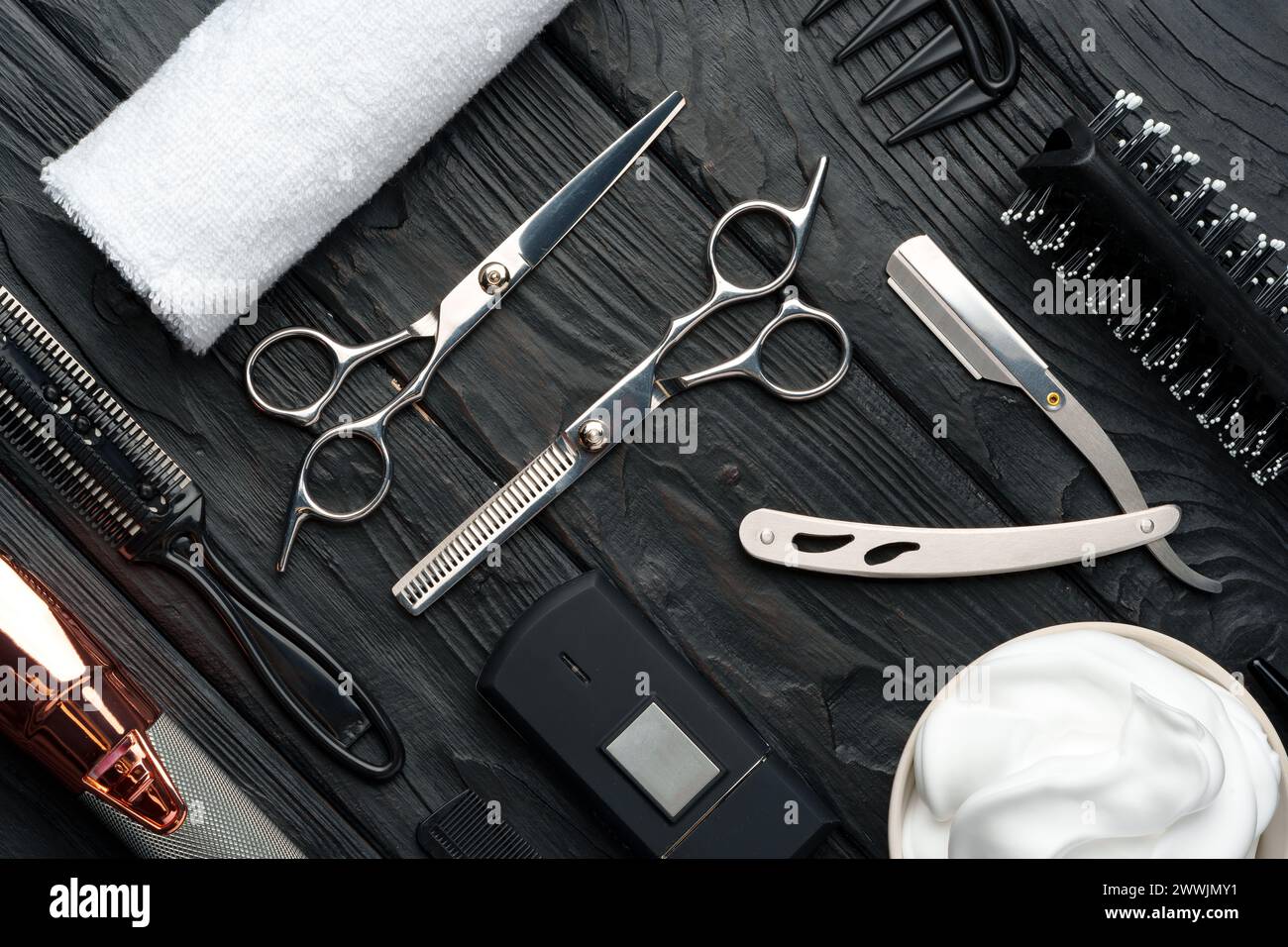 Professional Barber Tools Laid Out on Dark Wooden Surface Stock Photo ...