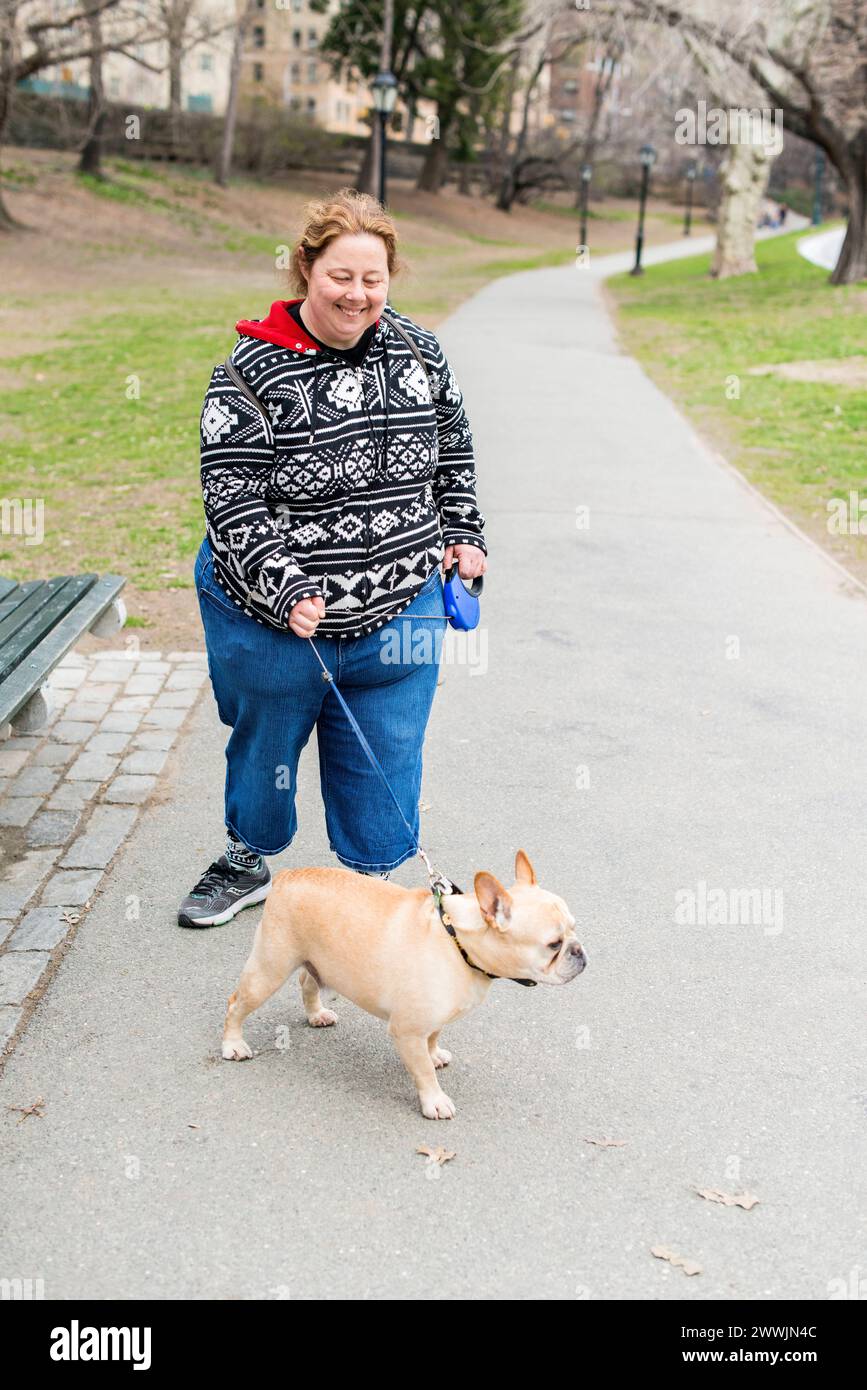 Female dogwalker New York City, USA. Female, caucasian dogwalker ...