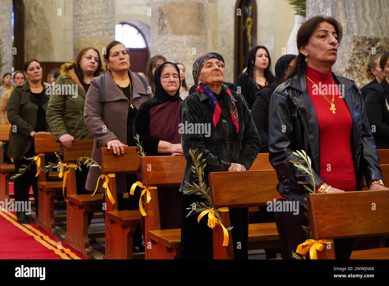 Al Hamdaniya, Iraq. 24th Mar, 2024. Iraqi Christians attend Palm Sunday ...
