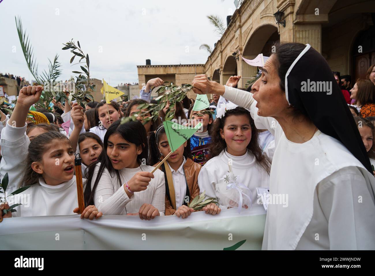Al Hamdaniya, Iraq. 24th Mar, 2024. Iraqi children participate in the ...