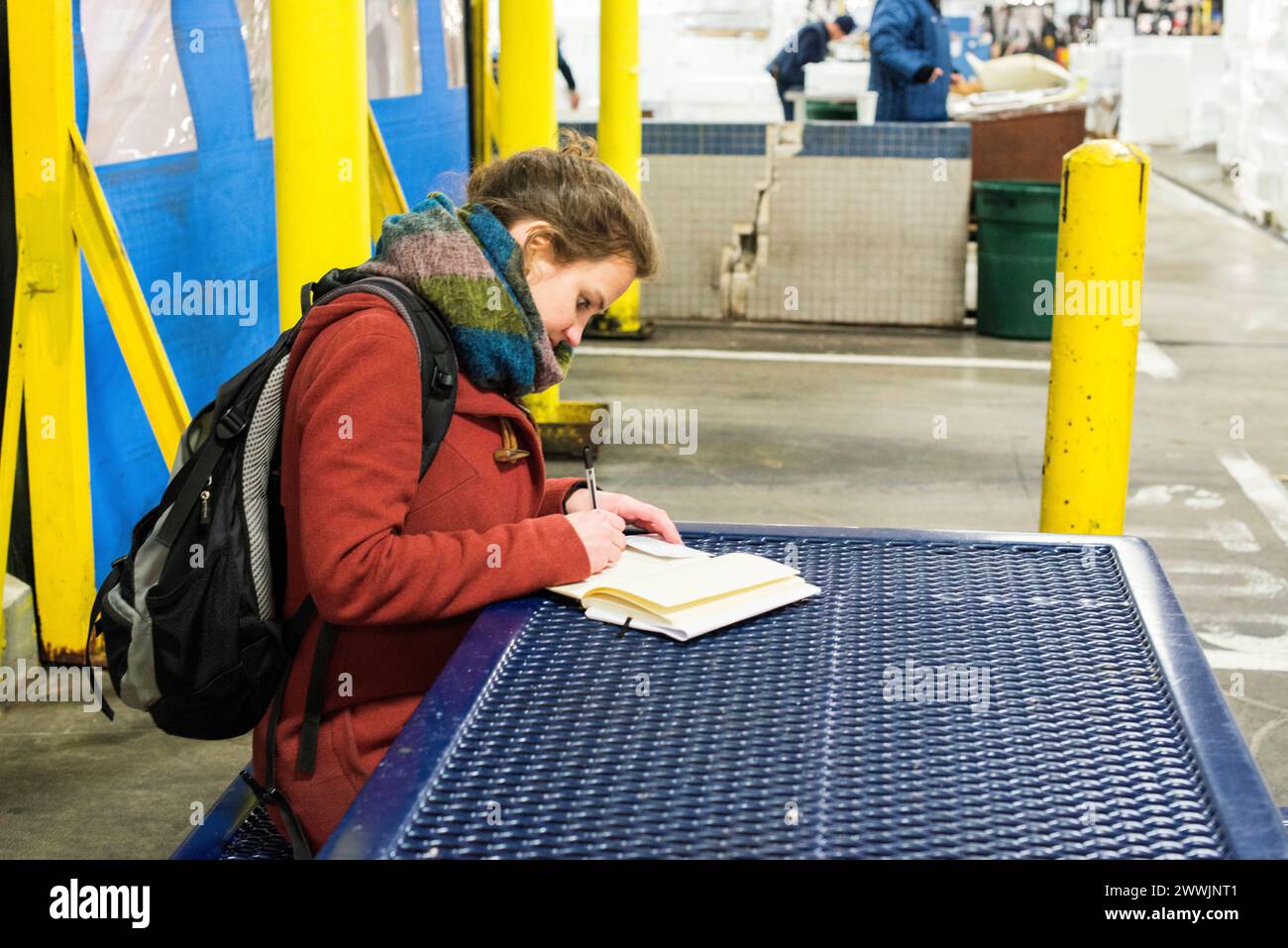 Young, female journalist making notes New York City, USA. Young adult ...