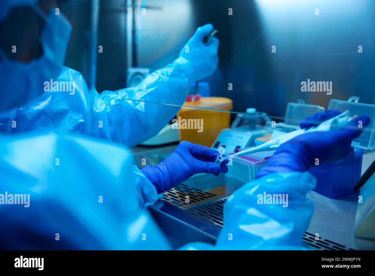 Laboratory workers use a pipette dispenser in their work Stock Photo ...