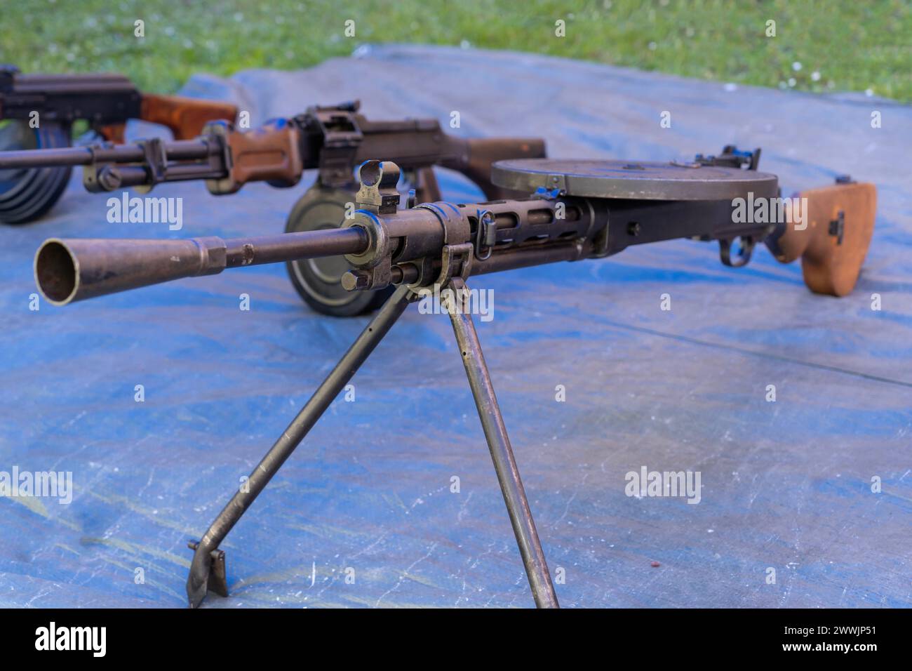 WW2 Soviet DP machine gun with round ammunition magazine on a blue ...