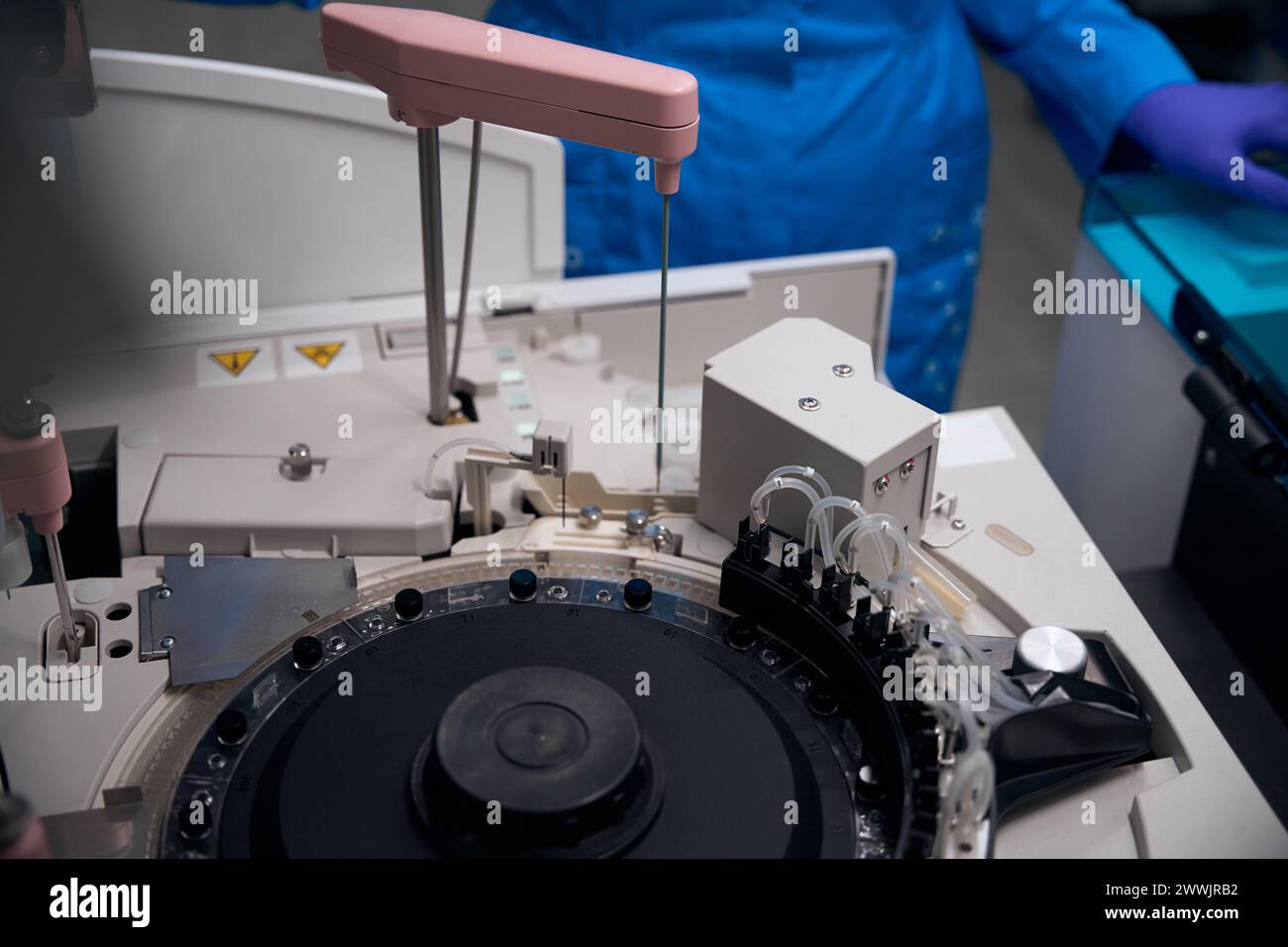 Laboratory immunologist uses device for automatic isolation of nucleic ...