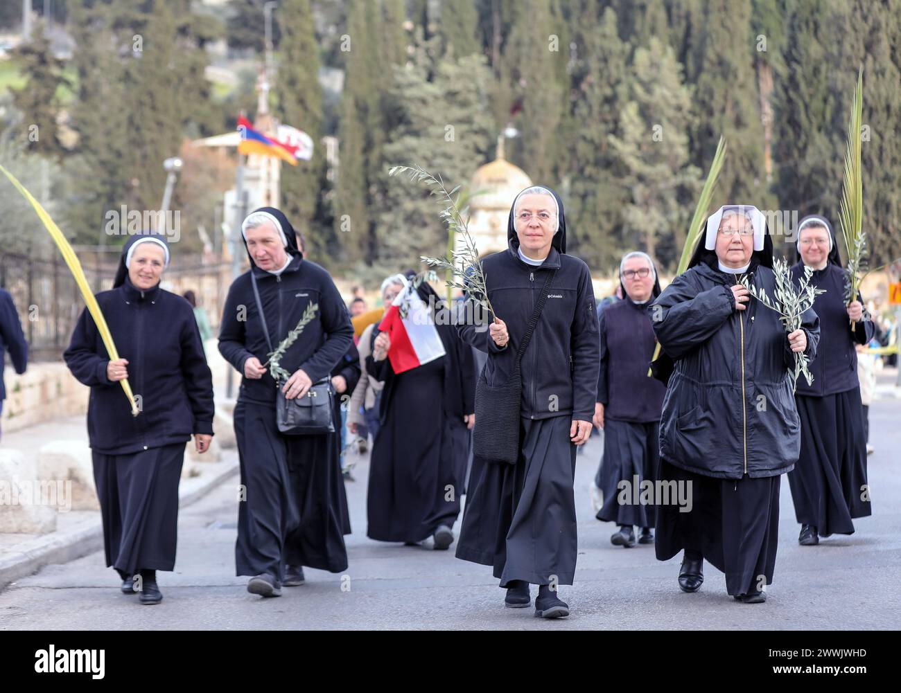 Nuns are marching at the Catholic Plam Sunday procession. They are ...