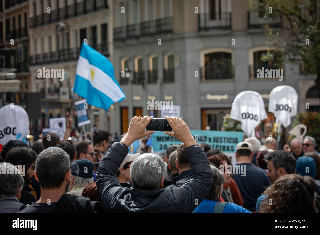 Madrid, Spain. 24th Mar, 2024. A man takes a photo with his cell phone ...