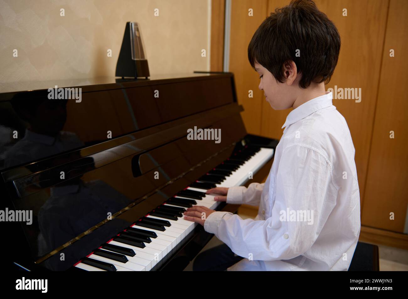 Confident portrait of an elementary age preteen boy, talented musician ...