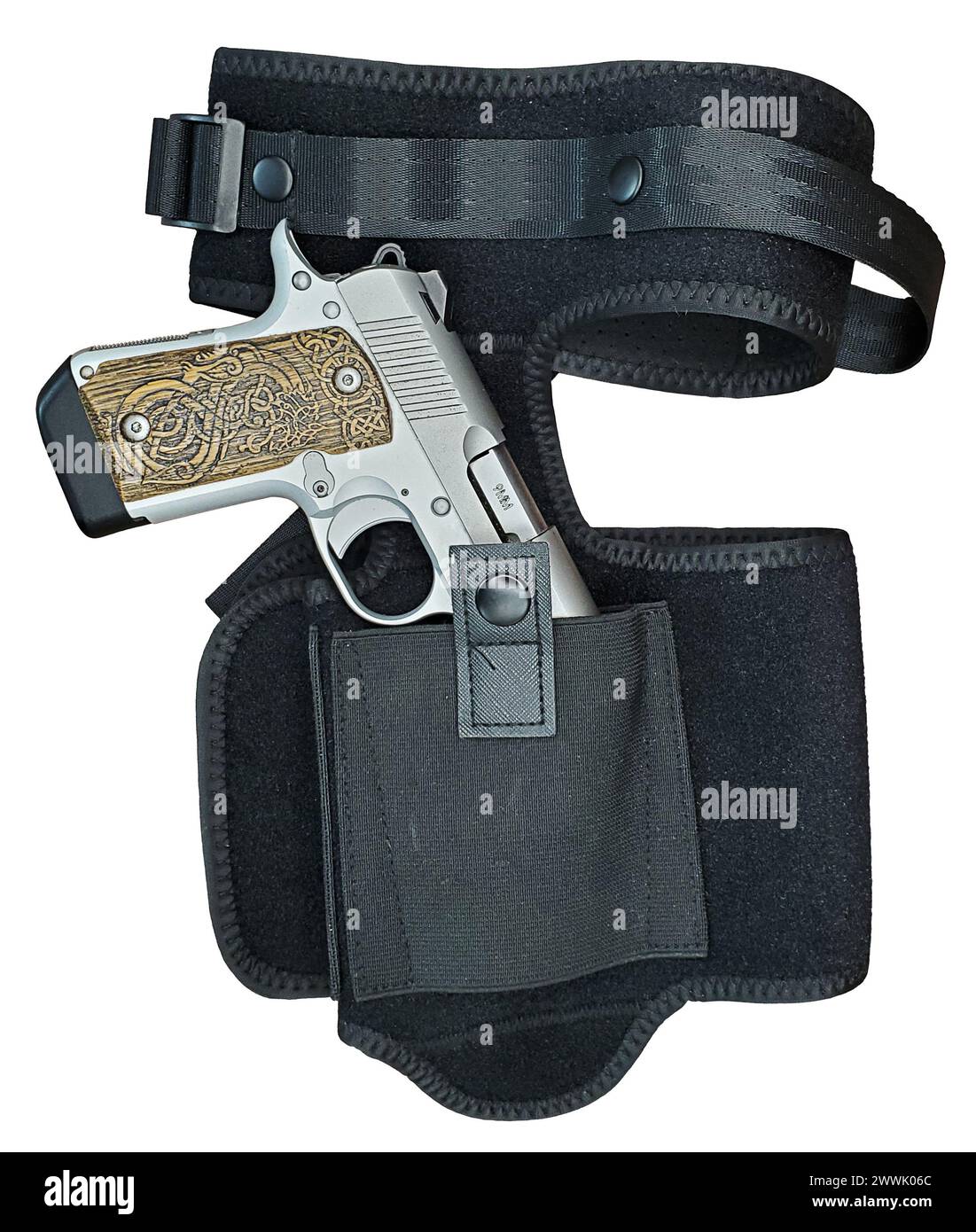 Silver gun pulled from a hip holster Stock Photo - Alamy