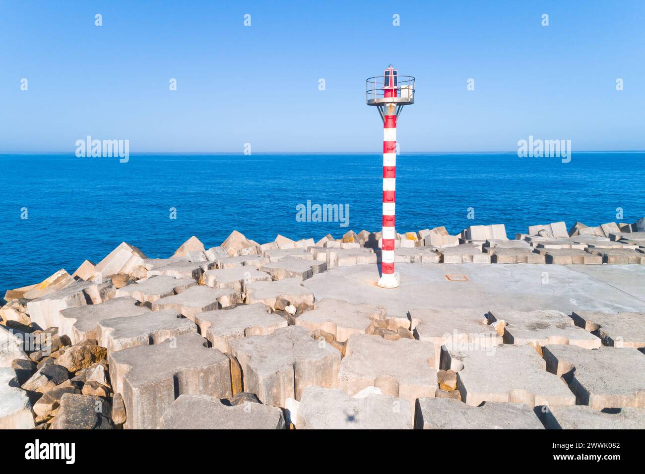 Lighthouse on concrete pier hi-res stock photography and images - Alamy
