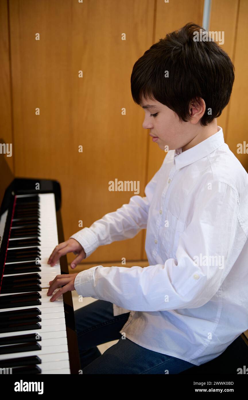 Hispanic teen learning piano hi-res stock photography and images - Alamy