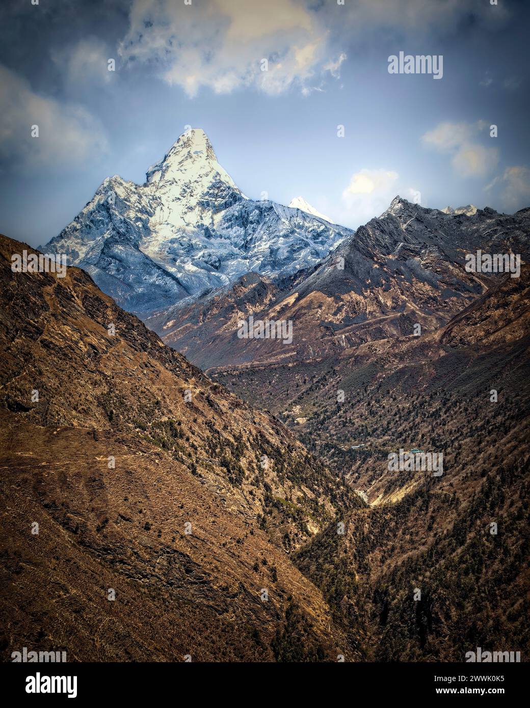 The trail leads upward toward Ama Dablam (background) on the trek to Mt ...