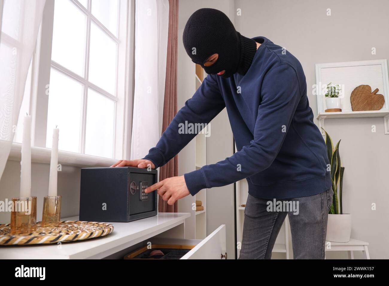 Thief breaking into safe hi-res stock photography and images - Alamy