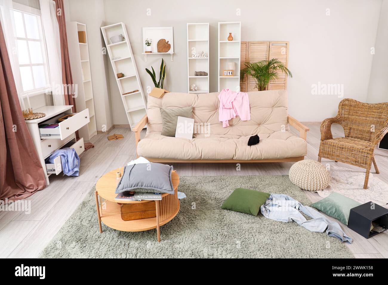 Interior of messy living room with sofa after robbery Stock Photo - Alamy