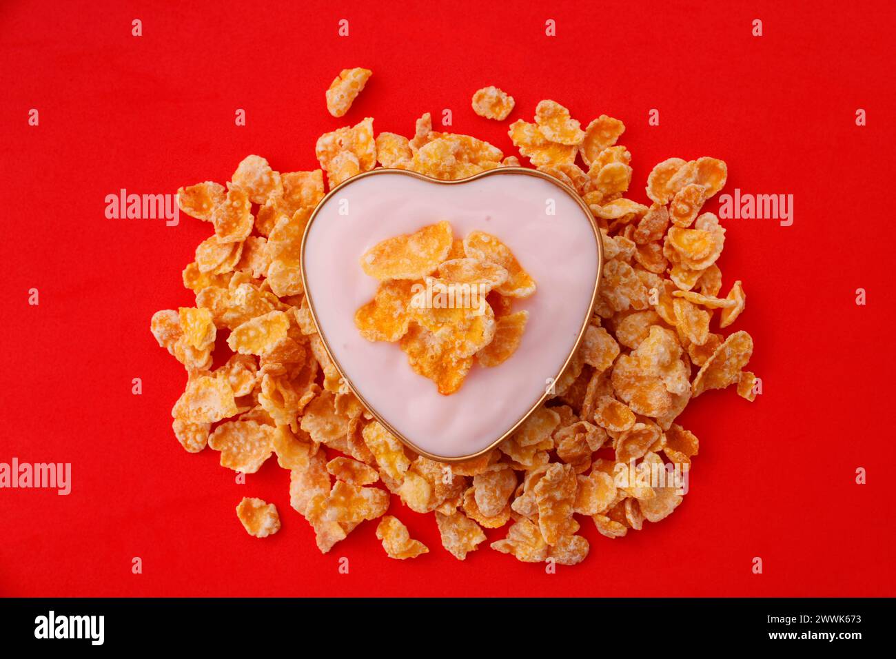 Heart with yogurt and sweetened corn flakes cereal Stock Photo - Alamy