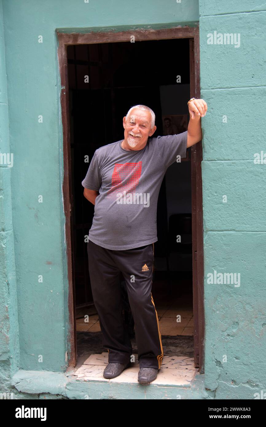Cuban man at work in Havana, Cuba smiles at the camera Stock Photo - Alamy