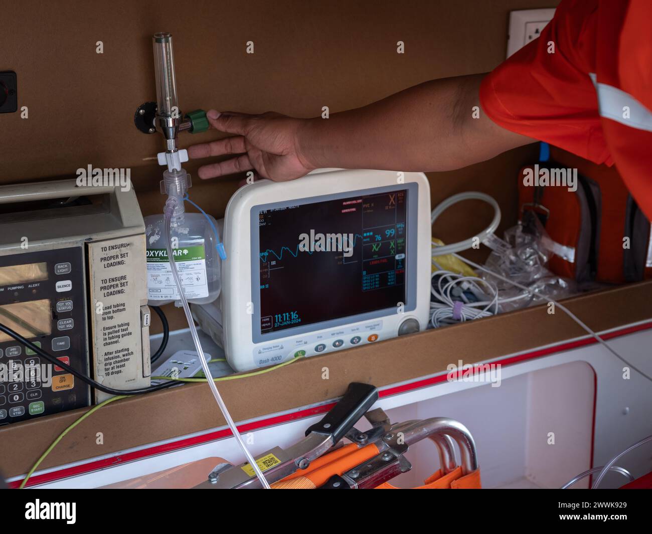 Emergency care workers turn on the ventilator in the ambulance Stock ...