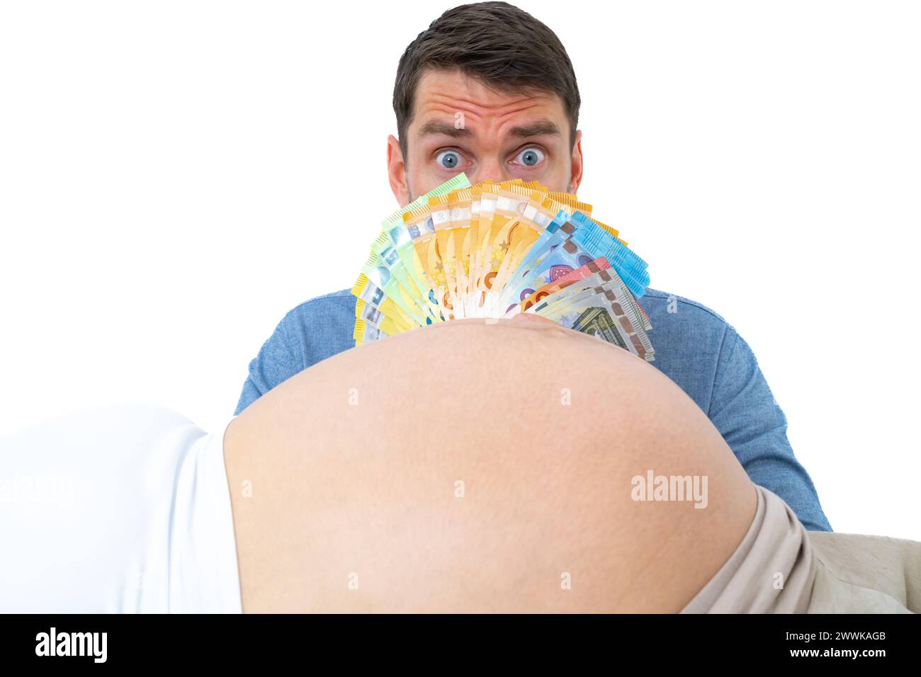 Description: Expectant father behind pregnant baby bump holds a stack ...