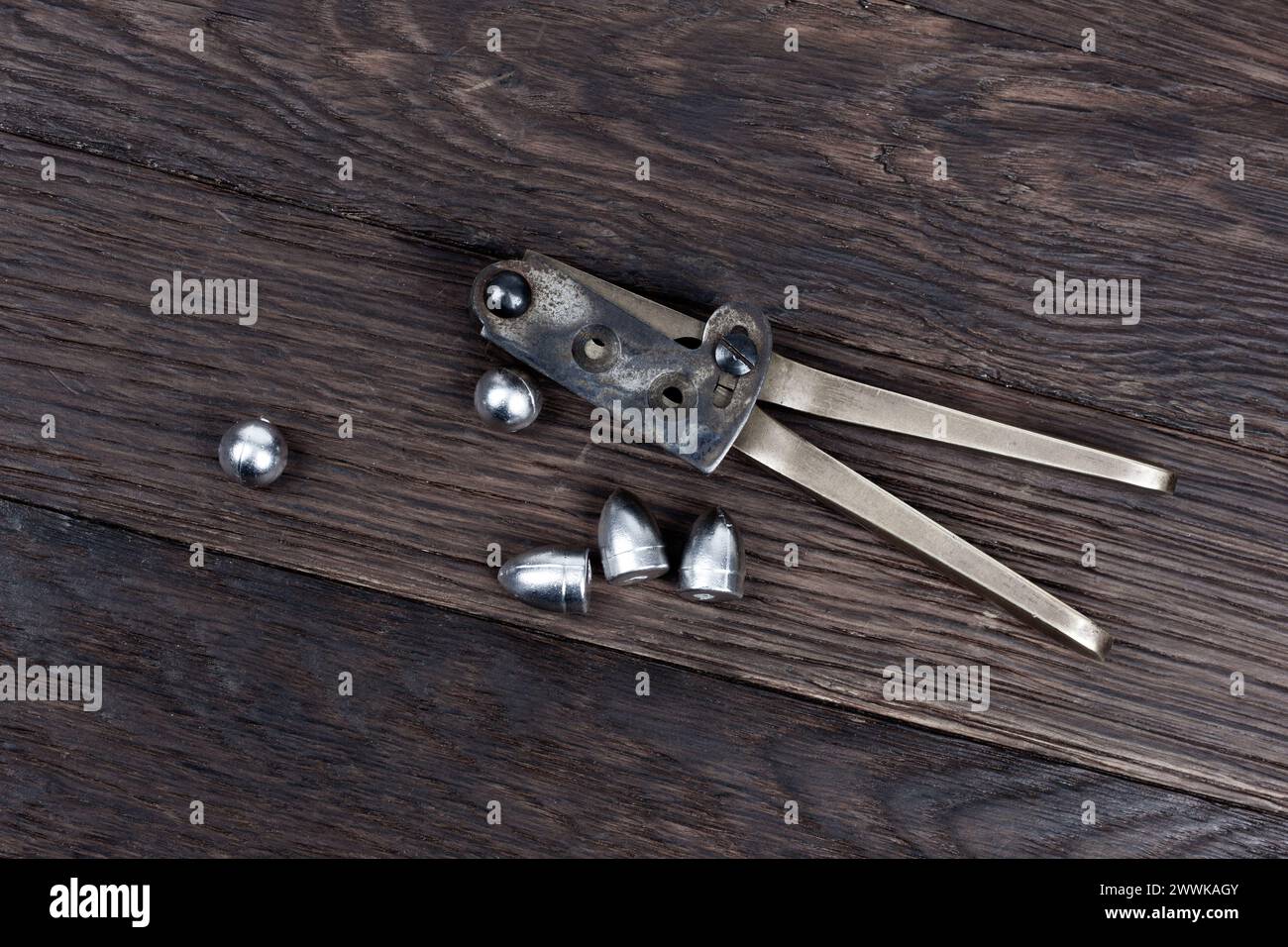 Antique old west bullet mold with bullets for revolver. Isolated on ...