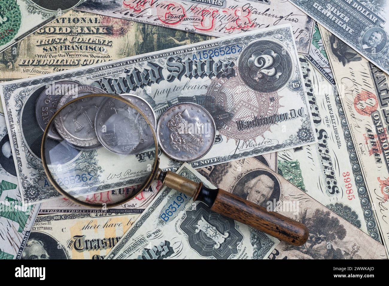 Old US banknotes and silver certificates with silver dollar coins and ...