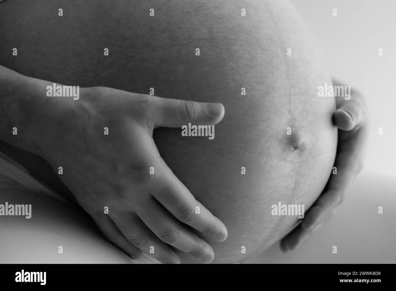 Pregnant black woman holding belly hi-res stock photography and images ...