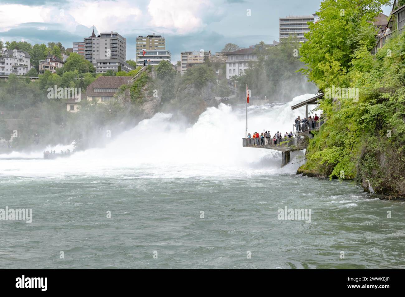 Description: Tourists experience the powerful water floods of the ...