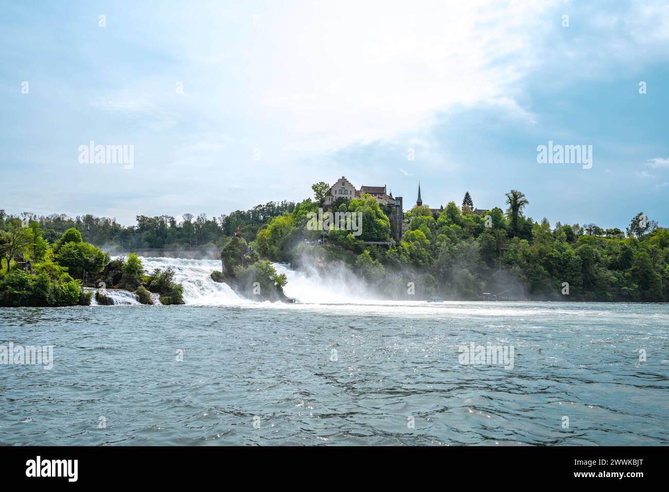 Description: Tourists watch the impressive waterfalls below Laufen ...
